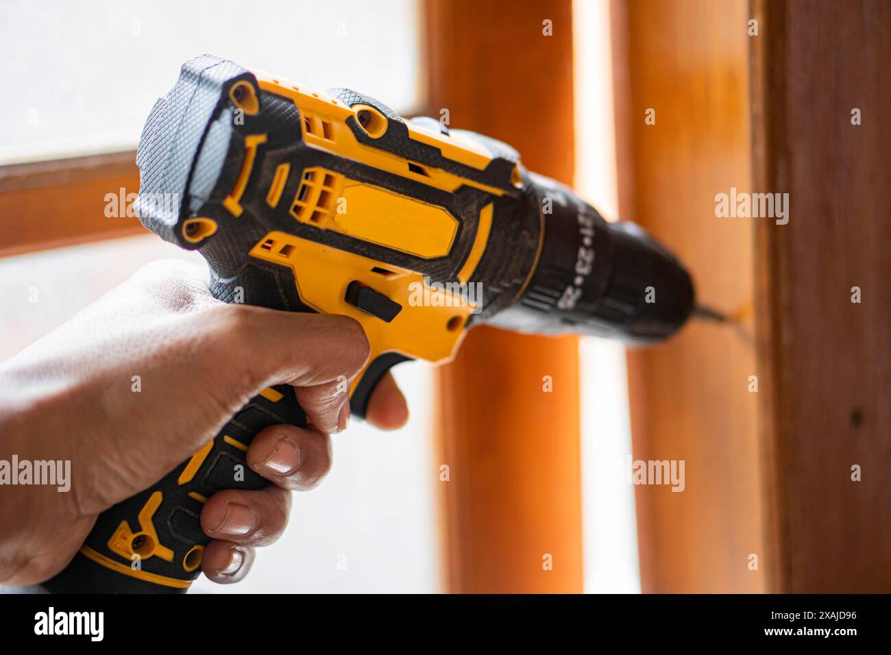 Person using a power drill hi-res stock photography and images - Alamy
