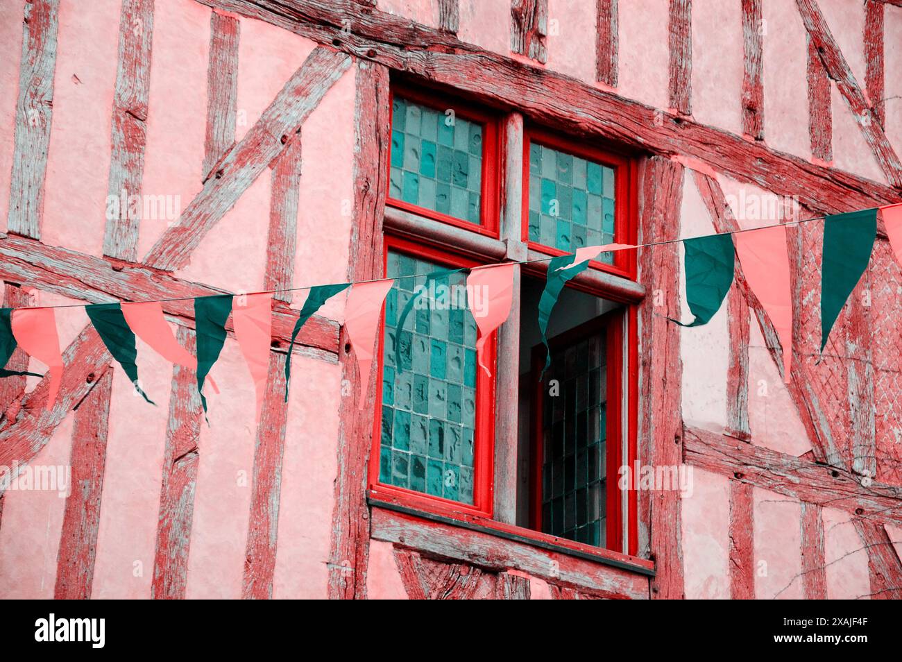 Retro fantasy style photo of street decorated with flags garland for ...