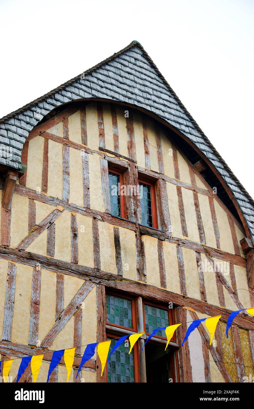 Street decorated with yellow blue flags garland for medieval festival ...