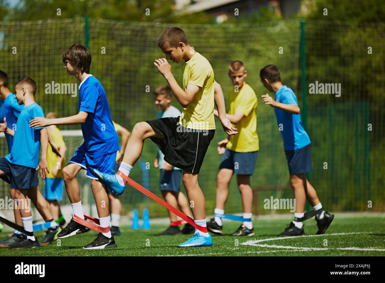 Dynamic Sports. Children in colorful sports uniforms engaged in soccer ...