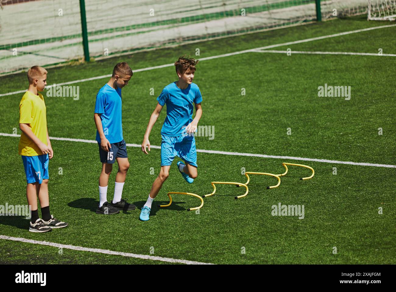 Dynamic Sports Exercise. Young soccer athletes perform agility ...
