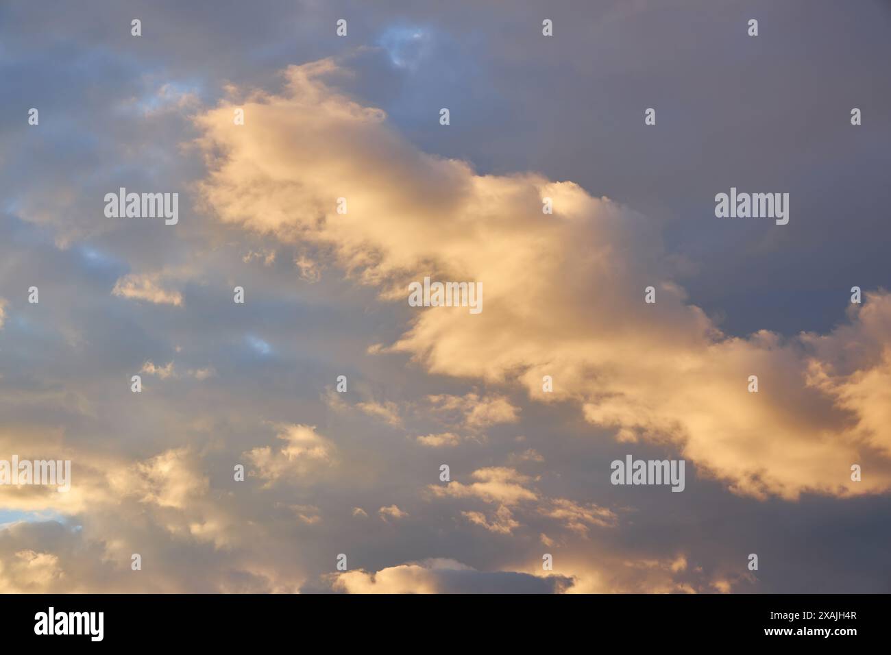 Cloudscape of cumulus sunset clouds with sunlight Stock Photo - Alamy
