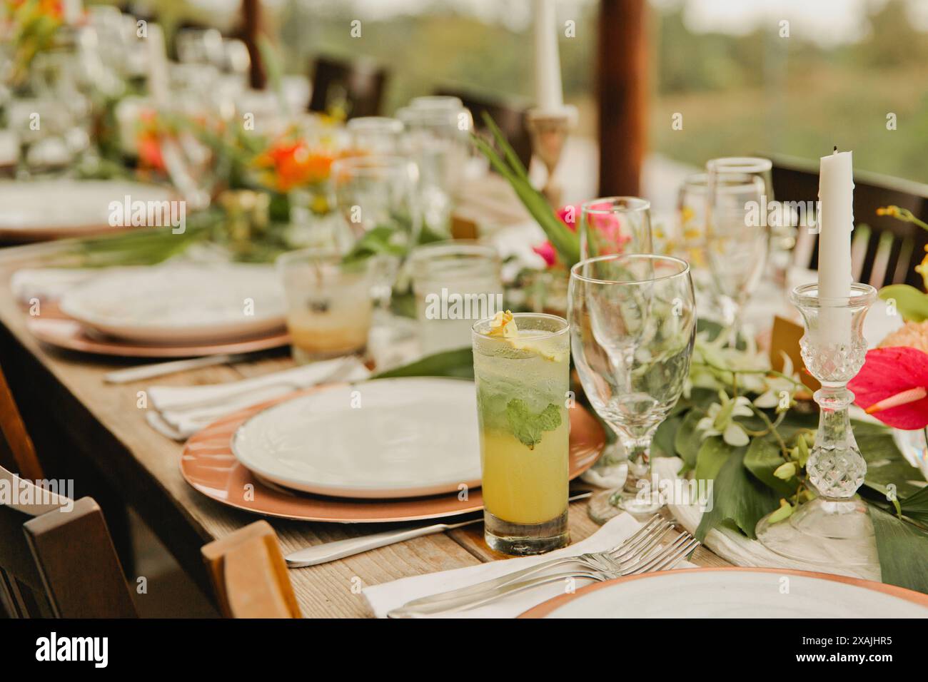 Tropical table setting in Hawaii at private dinner with cocktail Stock ...