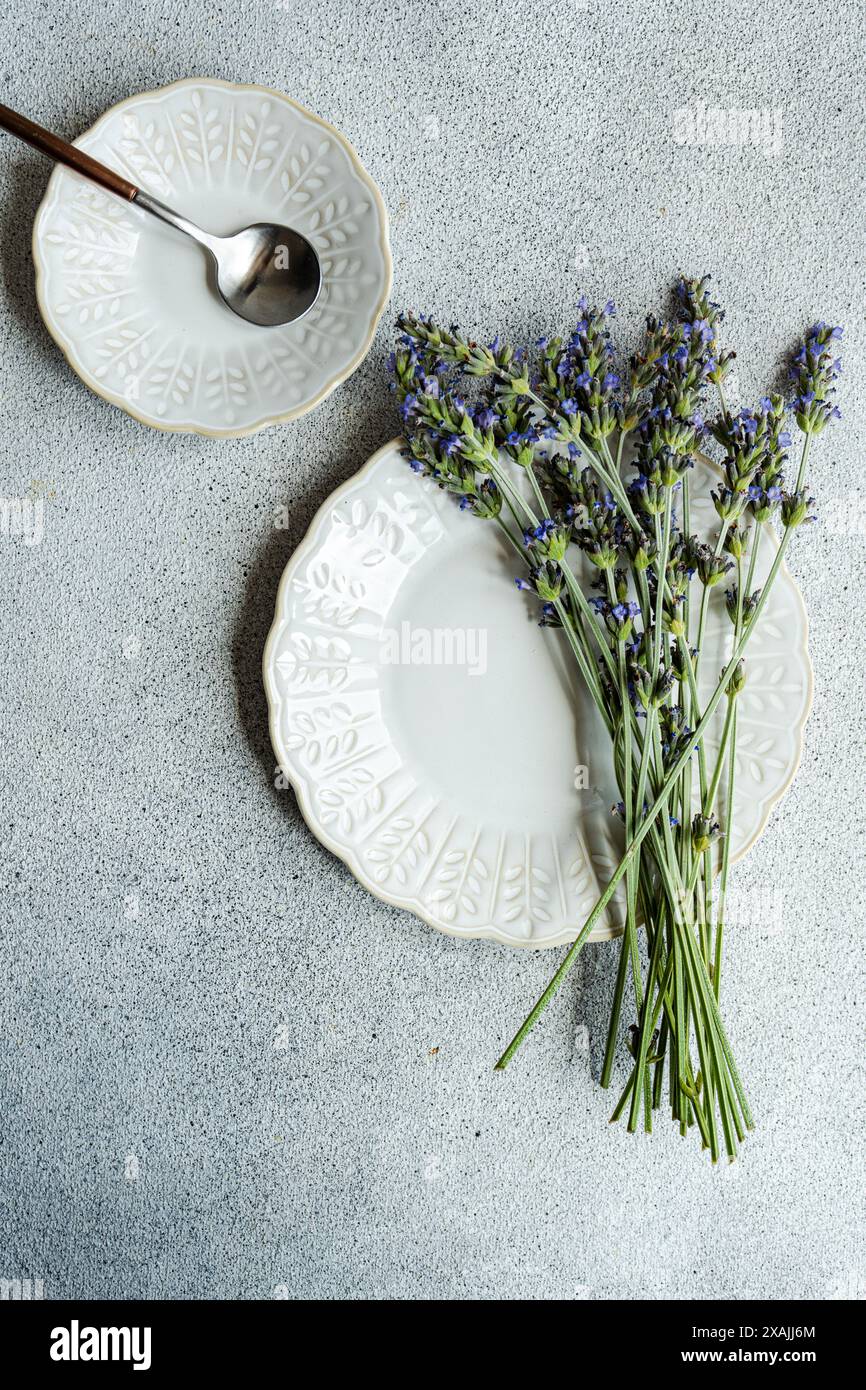 Ceramic tableware on concrete table background Stock Photo - Alamy