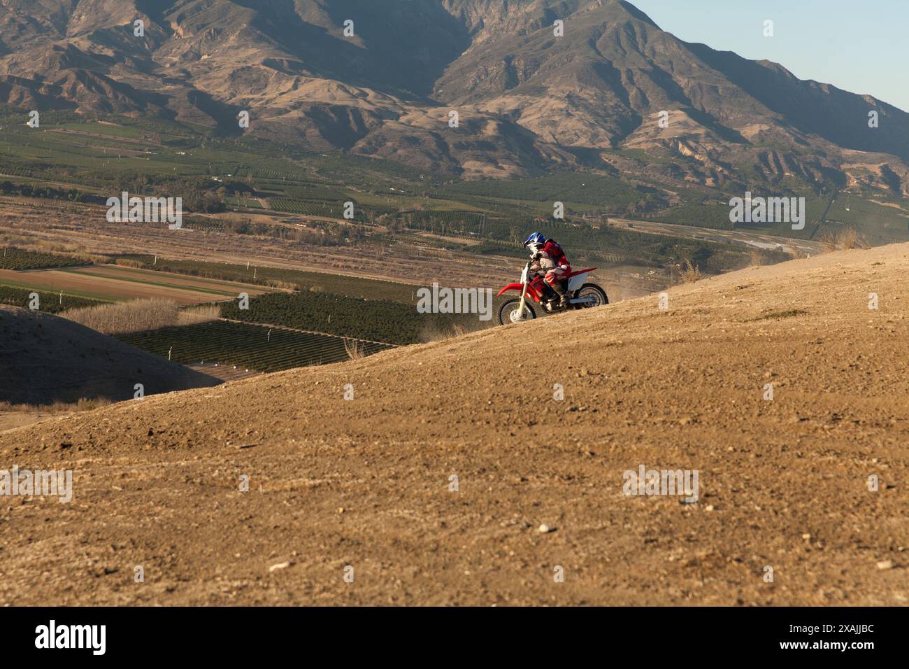 Skilled father and son riding dirt bike together in Santa Paula Stock ...
