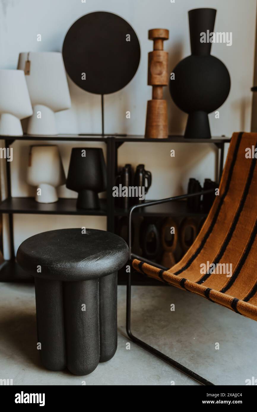 Wooden side table next to a canvas chair with aesthetic home decor ...