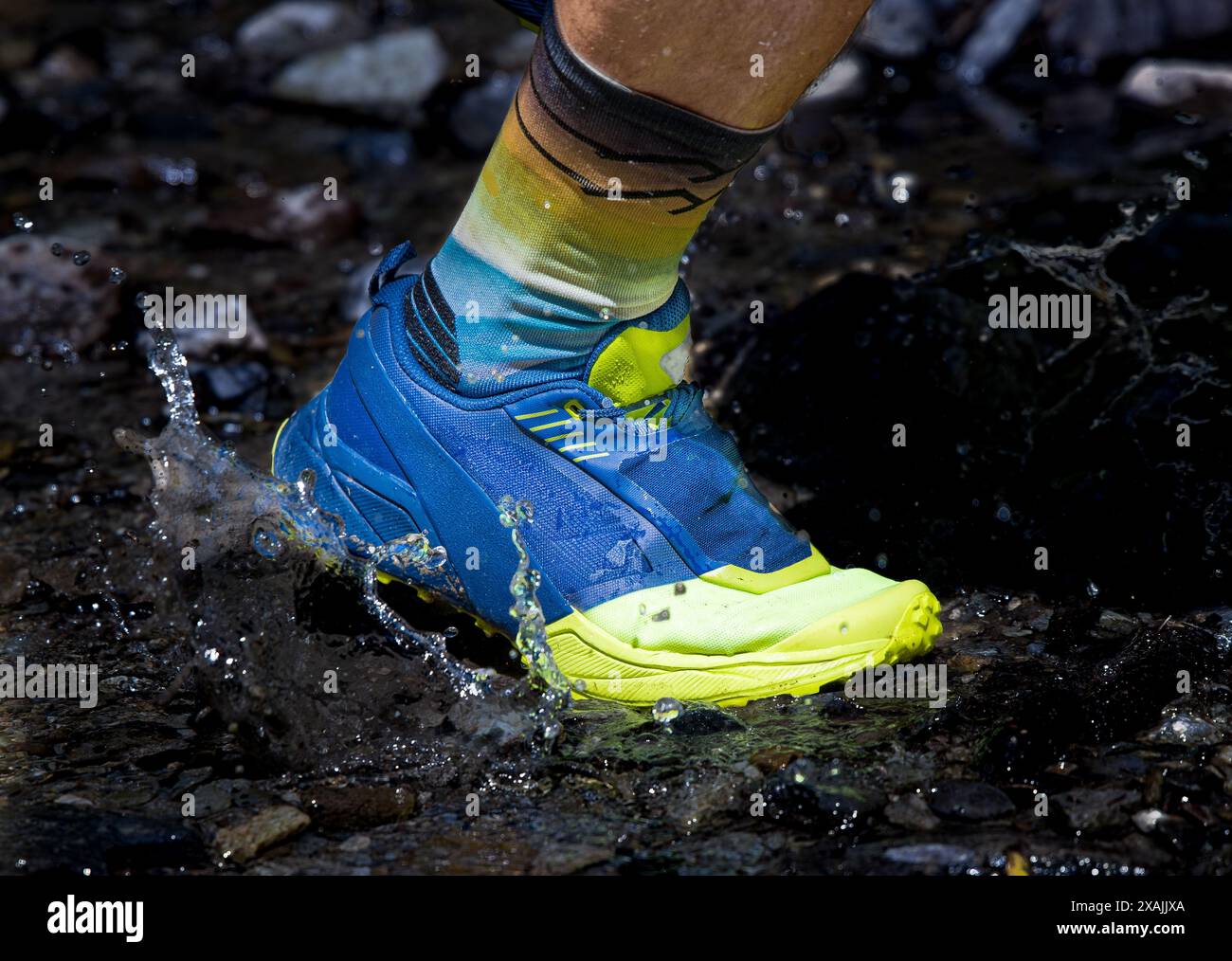 Trail running shoe splashing through water in dynamic action Stock ...