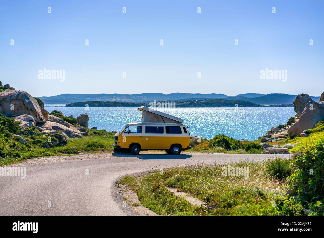 Old retro white and yellow camper van with rooftop on the coast Stock ...