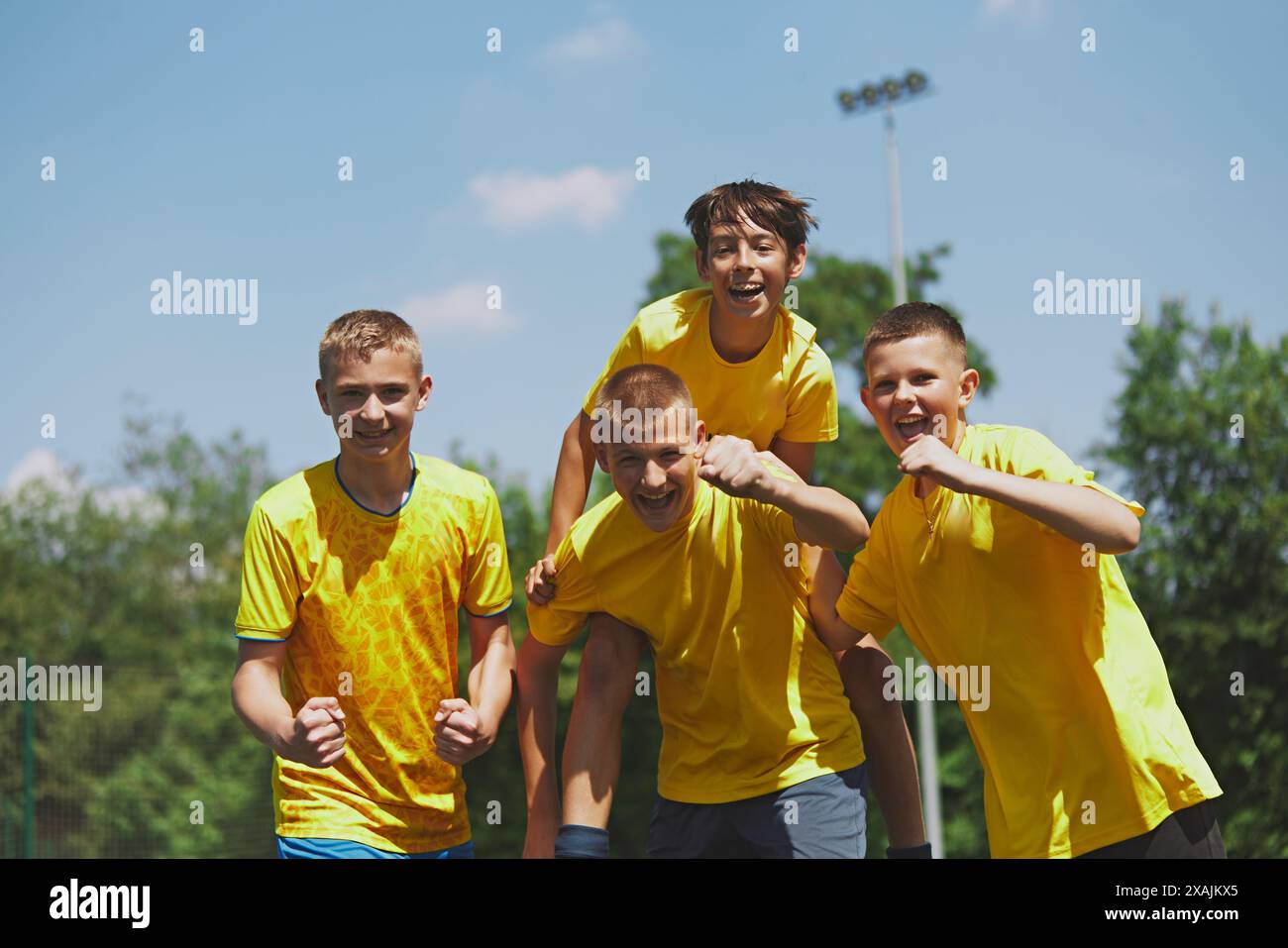 Celebrating Team Success. Young soccer players celebrate well-played ...