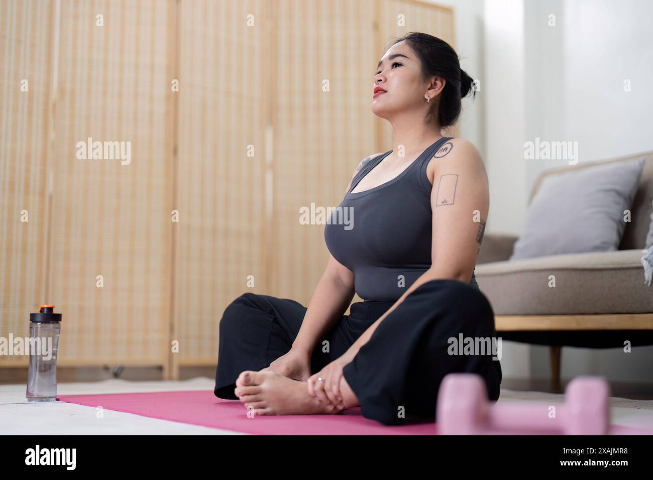 Confident Woman Practicing Yoga at Home, Embracing Fitness Journey ...