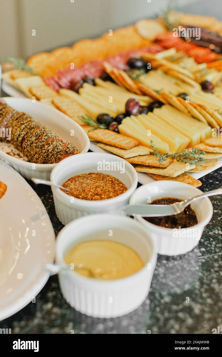 Meat, cheese, dips and appetizer display at event Stock Photo - Alamy