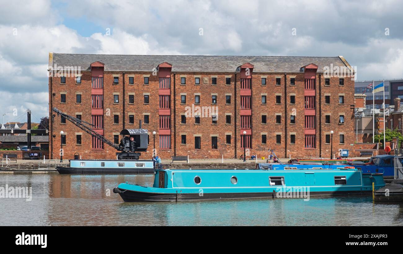 Scene in the historic Gloucester docks area with narrowboats moored in ...