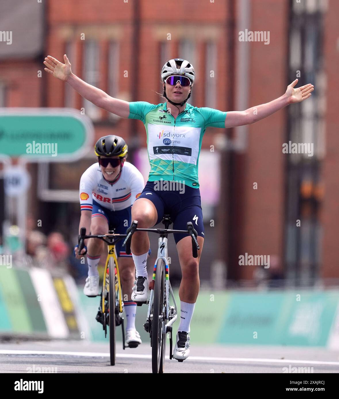 Team SD Worx-Protime's Lotte Kopecky crosses the line ahead of Great Britain's Anna Henderson to ...