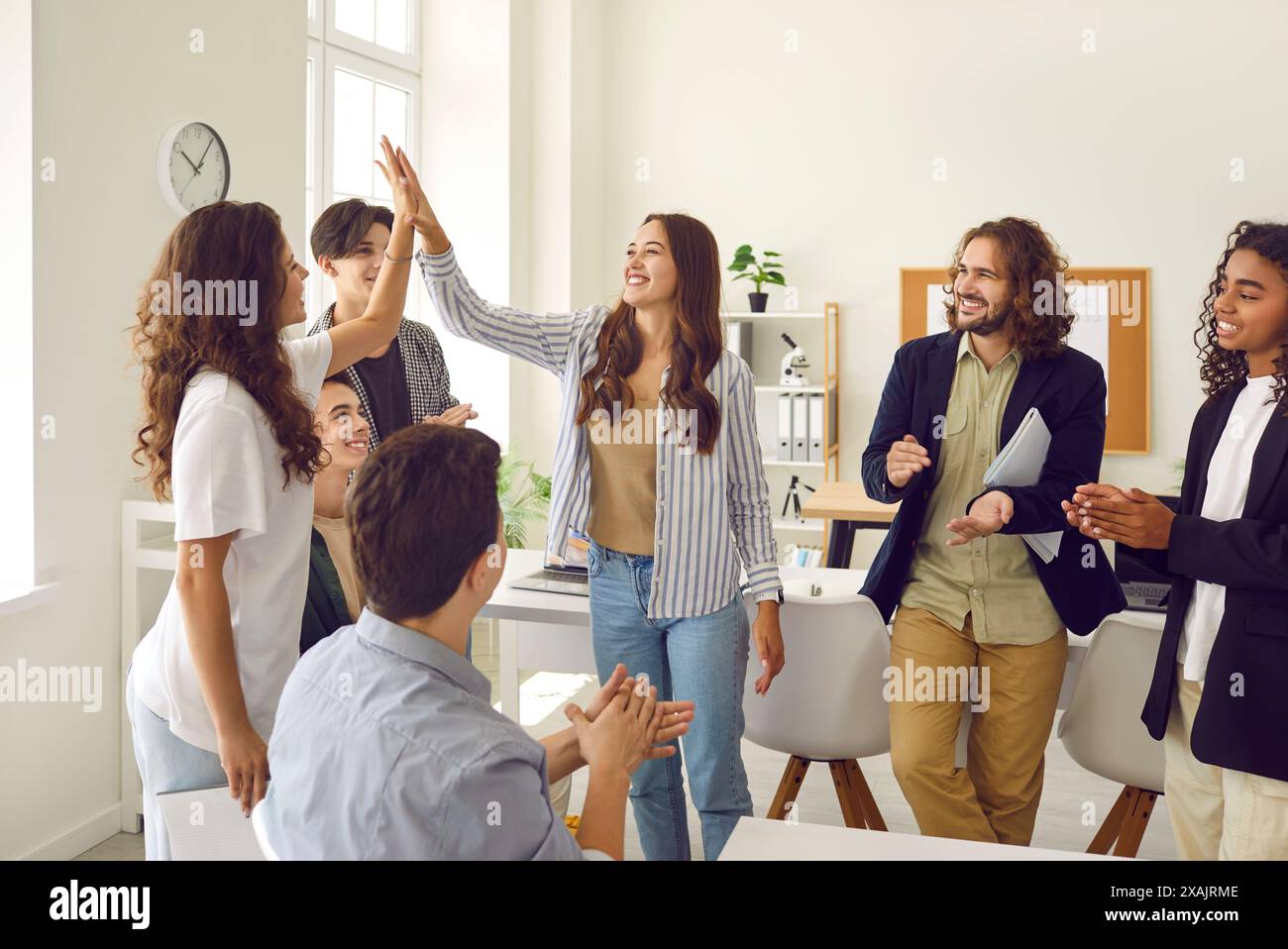 Group of happy high school classmates and friends having fun in the ...