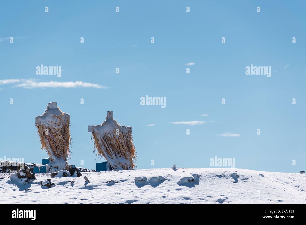 Crosses on top of a snowy mountain in the Andes mountain range in Peru ...