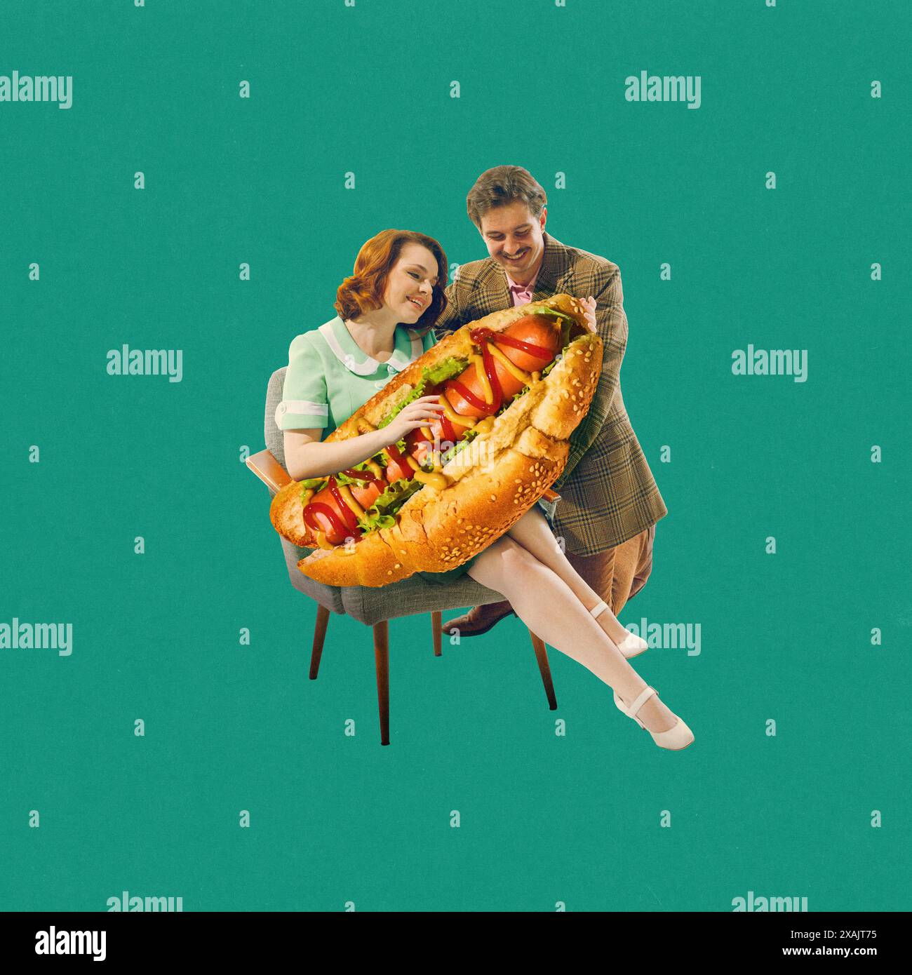Vintage-style couple holding giant hot dog against teal background ...