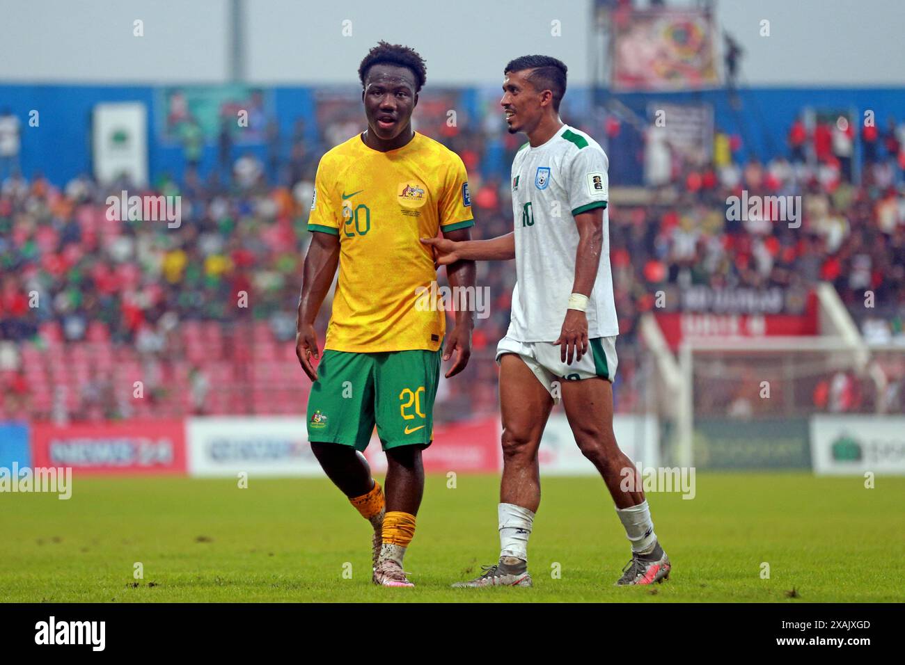 Bangladeshi forward Rakib Hossain (R) and Australia forward Nestory ...