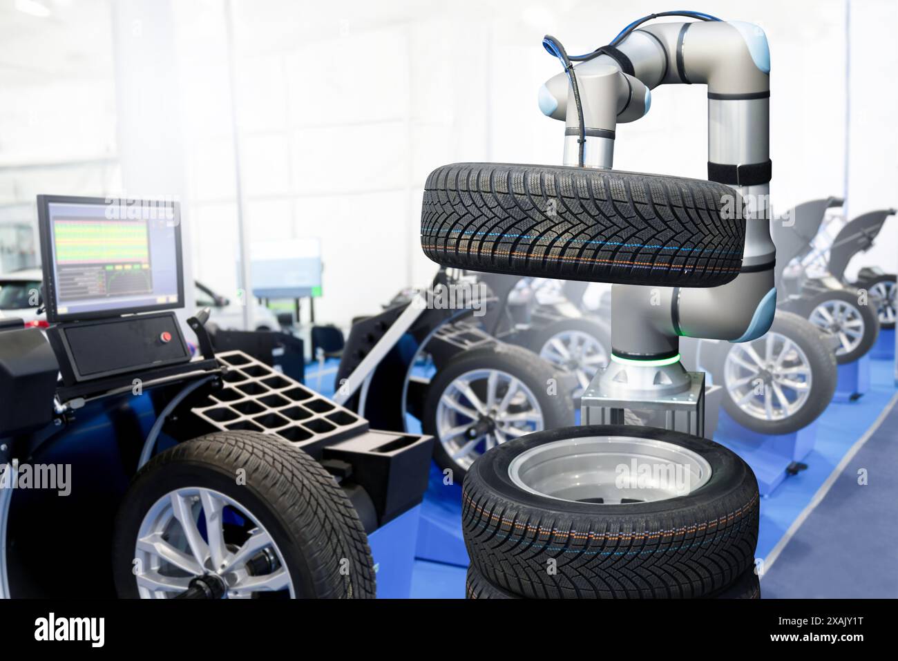 Car wheel balancing device for tire fitting Stock Photo - Alamy