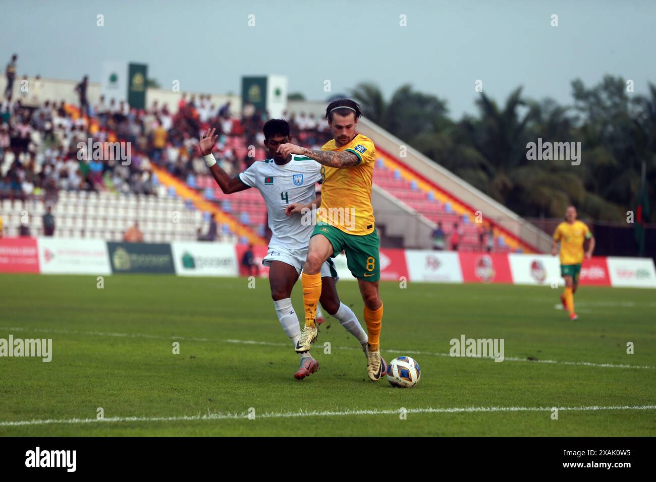 Bangladeshi defender Topu Barman and Australia midfielder Connor ...