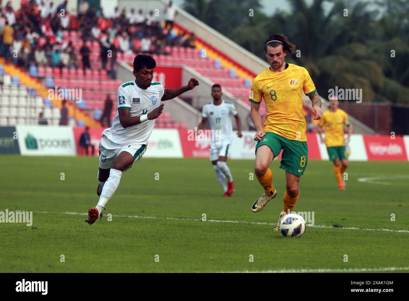 Bangladeshi defender Topu Barman and Australia midfielder Connor ...