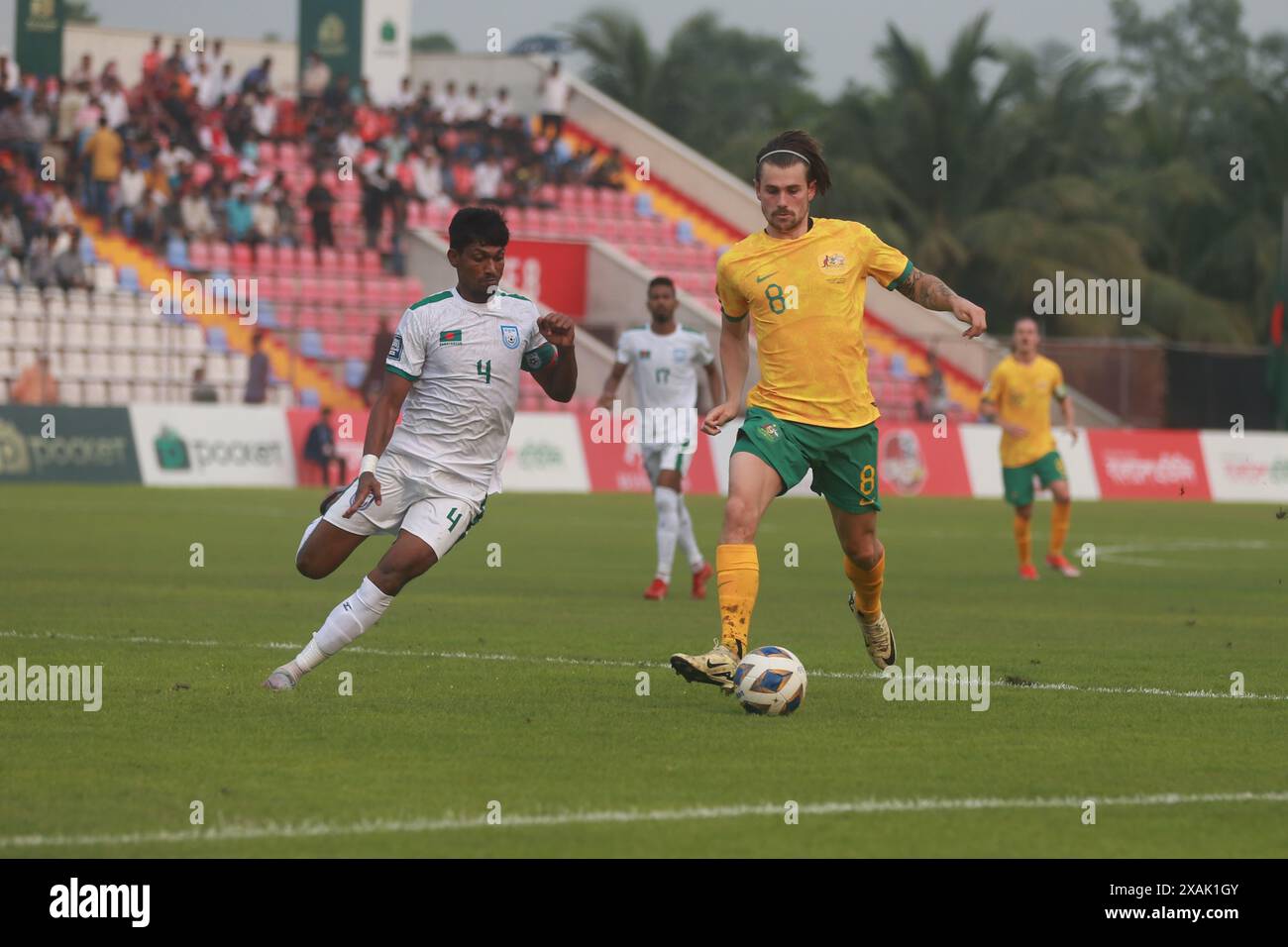 Bangladeshi defender Topu Barman and Australia midfielder Connor ...