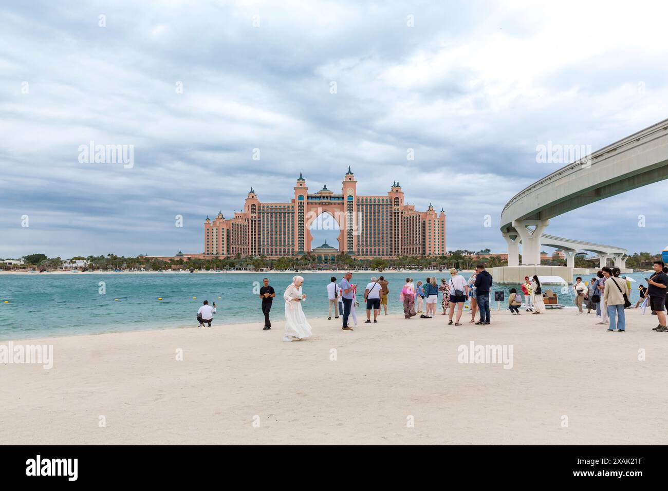 Tourists at The Pointe viewpoint, view to Atlantis The Palm hotel ...