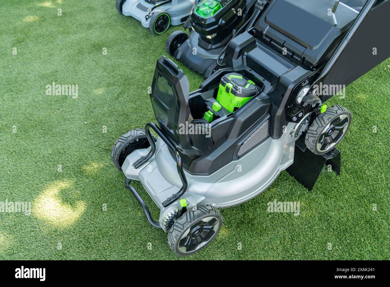 Battery powered electric lawn mowers Stock Photo - Alamy