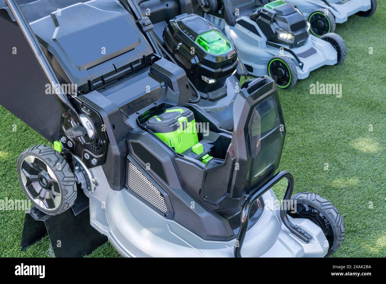 Battery powered electric lawn mowers Stock Photo - Alamy