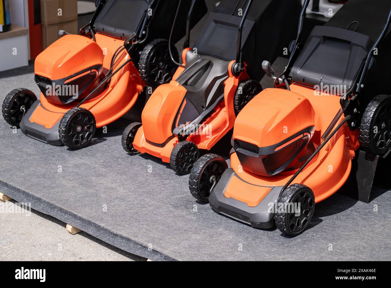 Electric lawn mowers in a row Stock Photo - Alamy