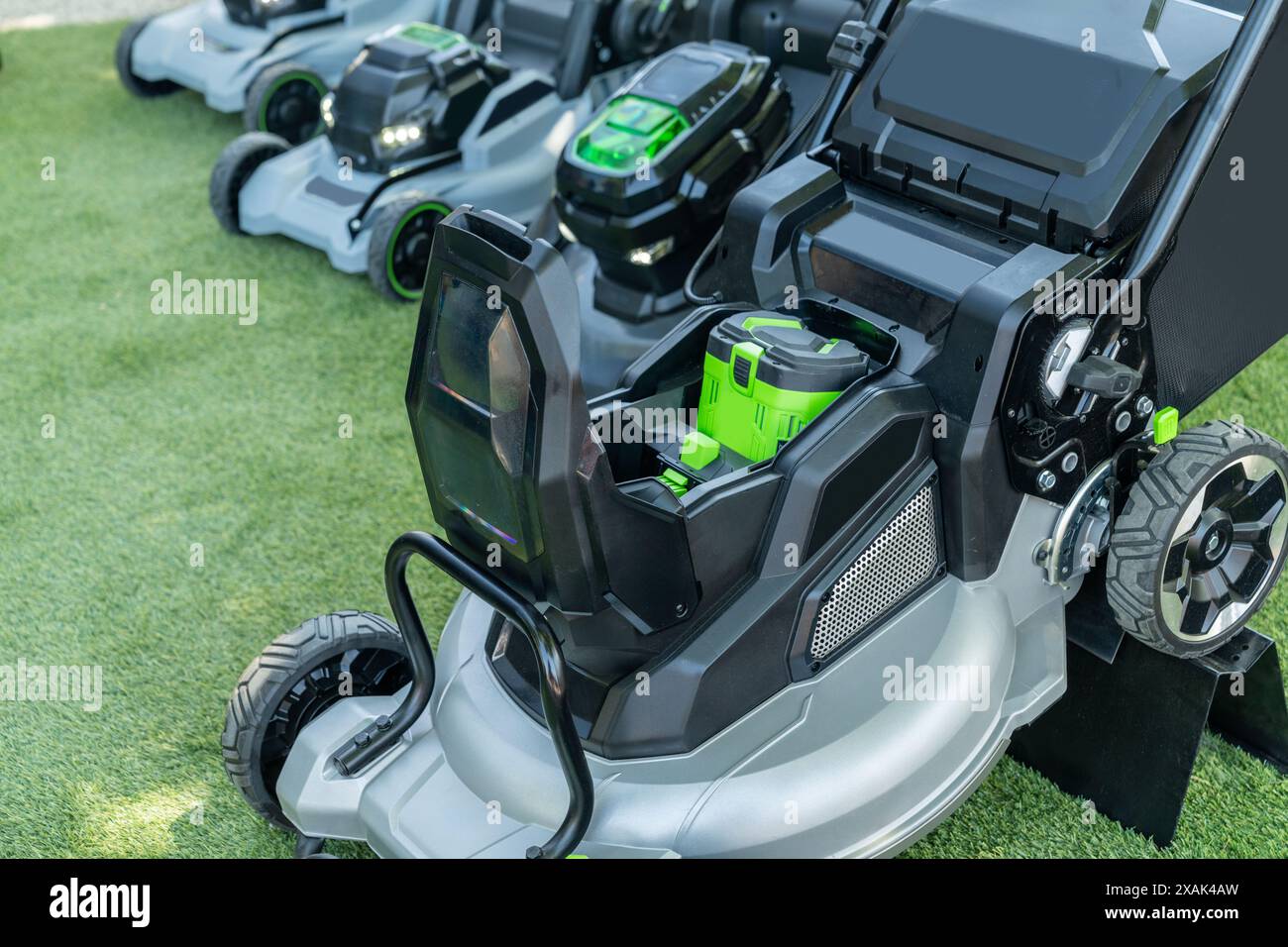 Battery powered electric lawn mowers Stock Photo - Alamy
