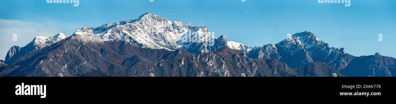 Snowcaped mount Grigna and mount San Martino at lake Como, seen from ...