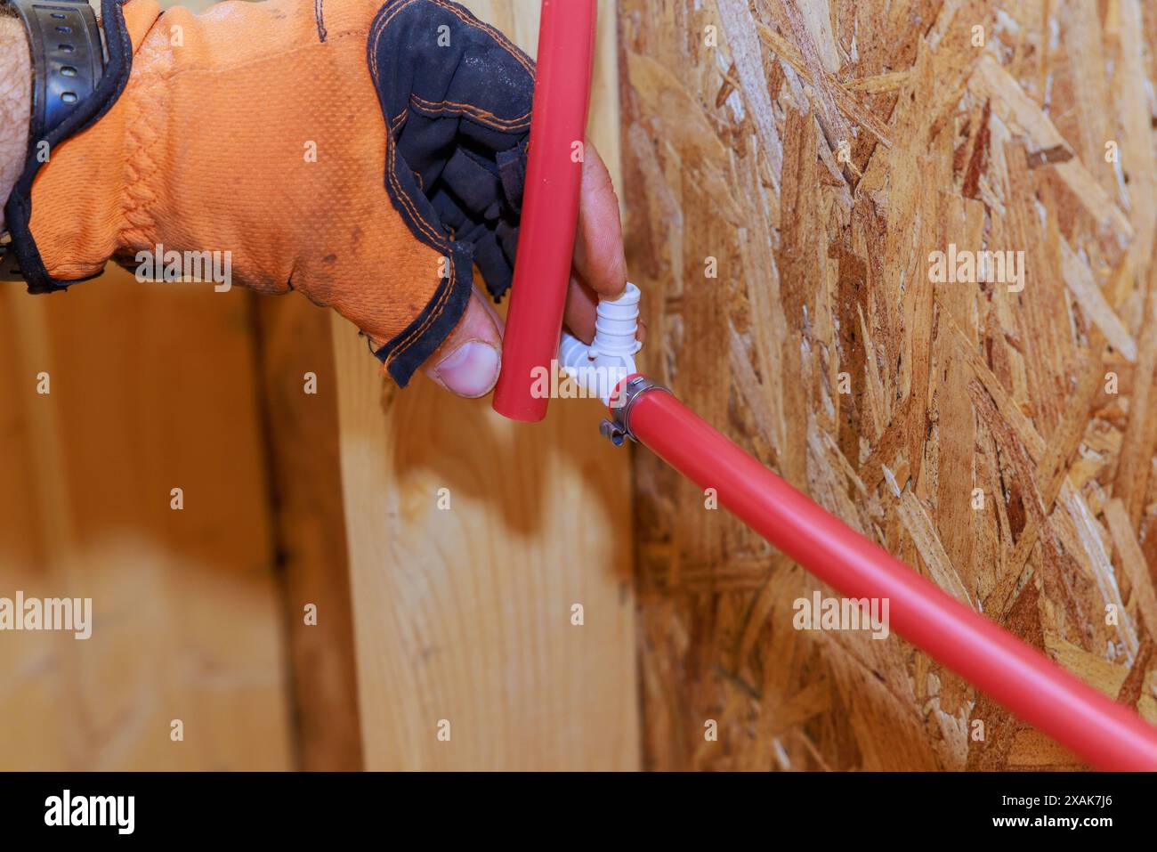 Plumbing contractor assembles installation connects PVC plastic water ...