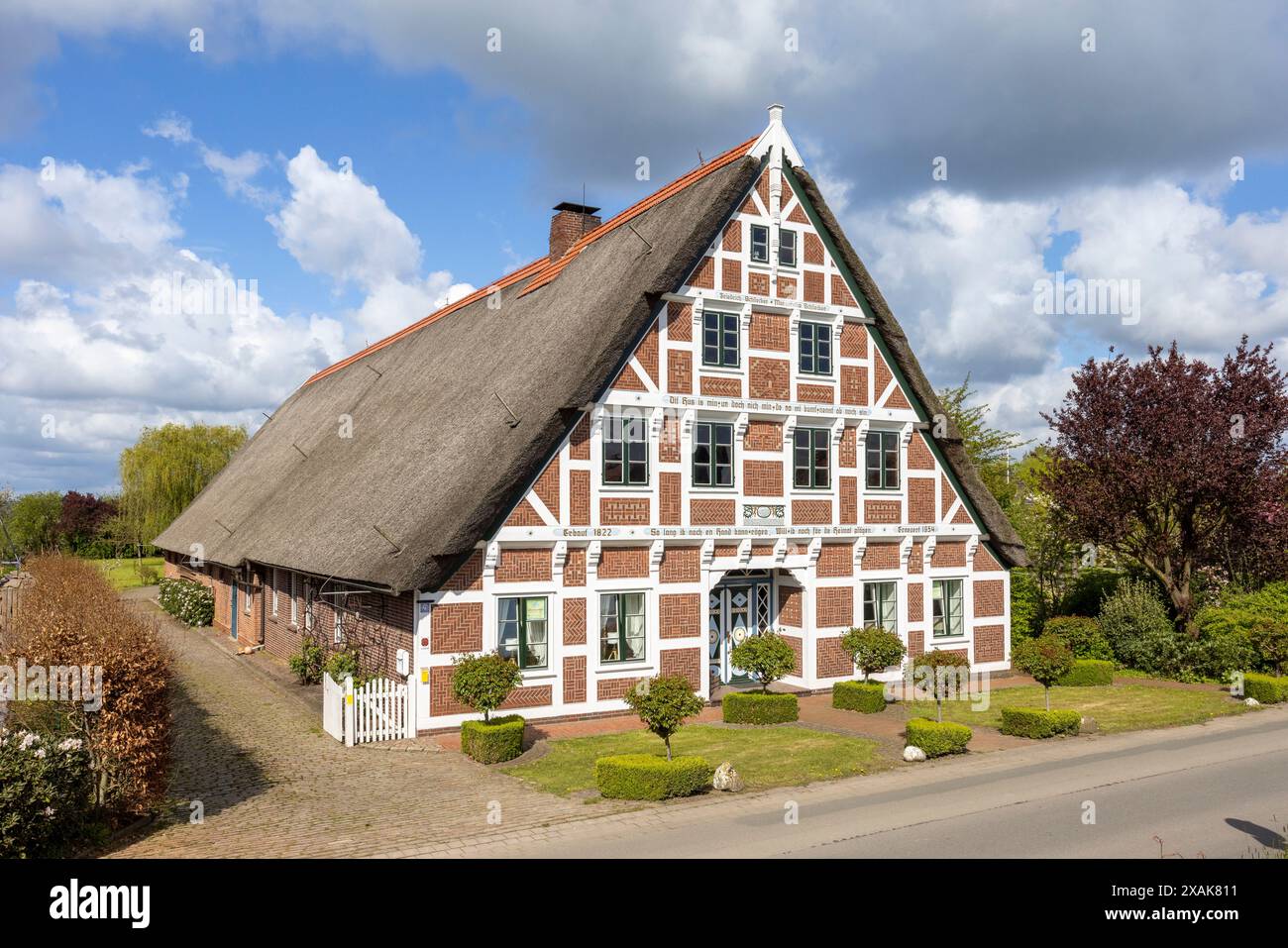 Old farmhouse, half-timbered house with thatched roof Stock Photo - Alamy