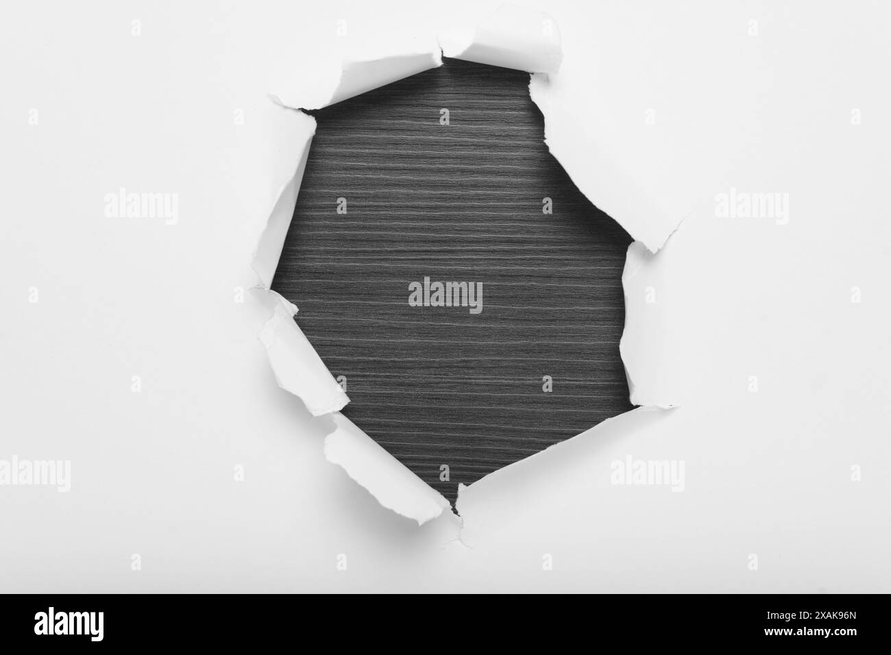 Torn hole in center Black and White Stock Photos & Images - Alamy