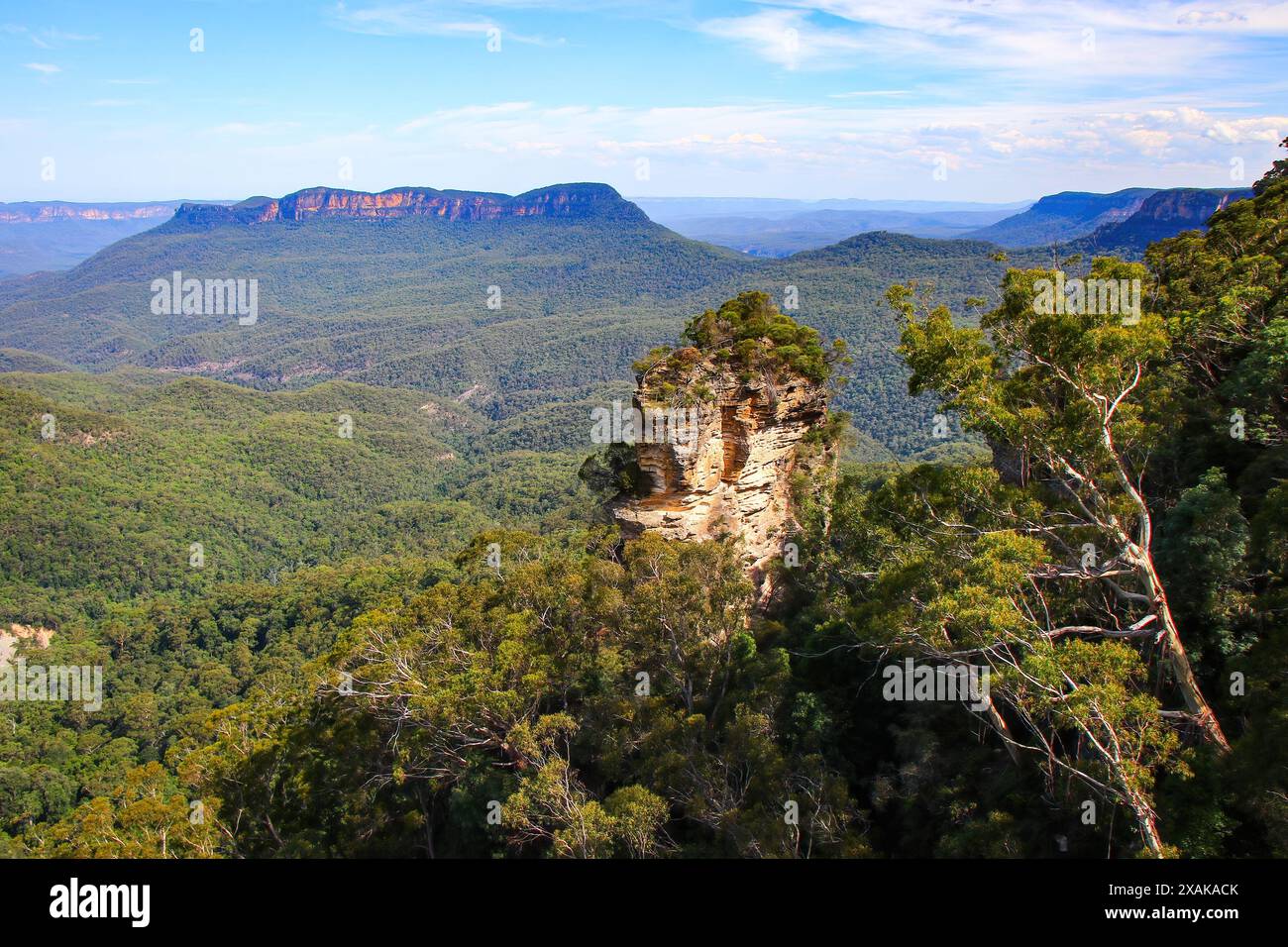 Orphan Rock, a rocky outcrop protruding over the rainforest of the ...