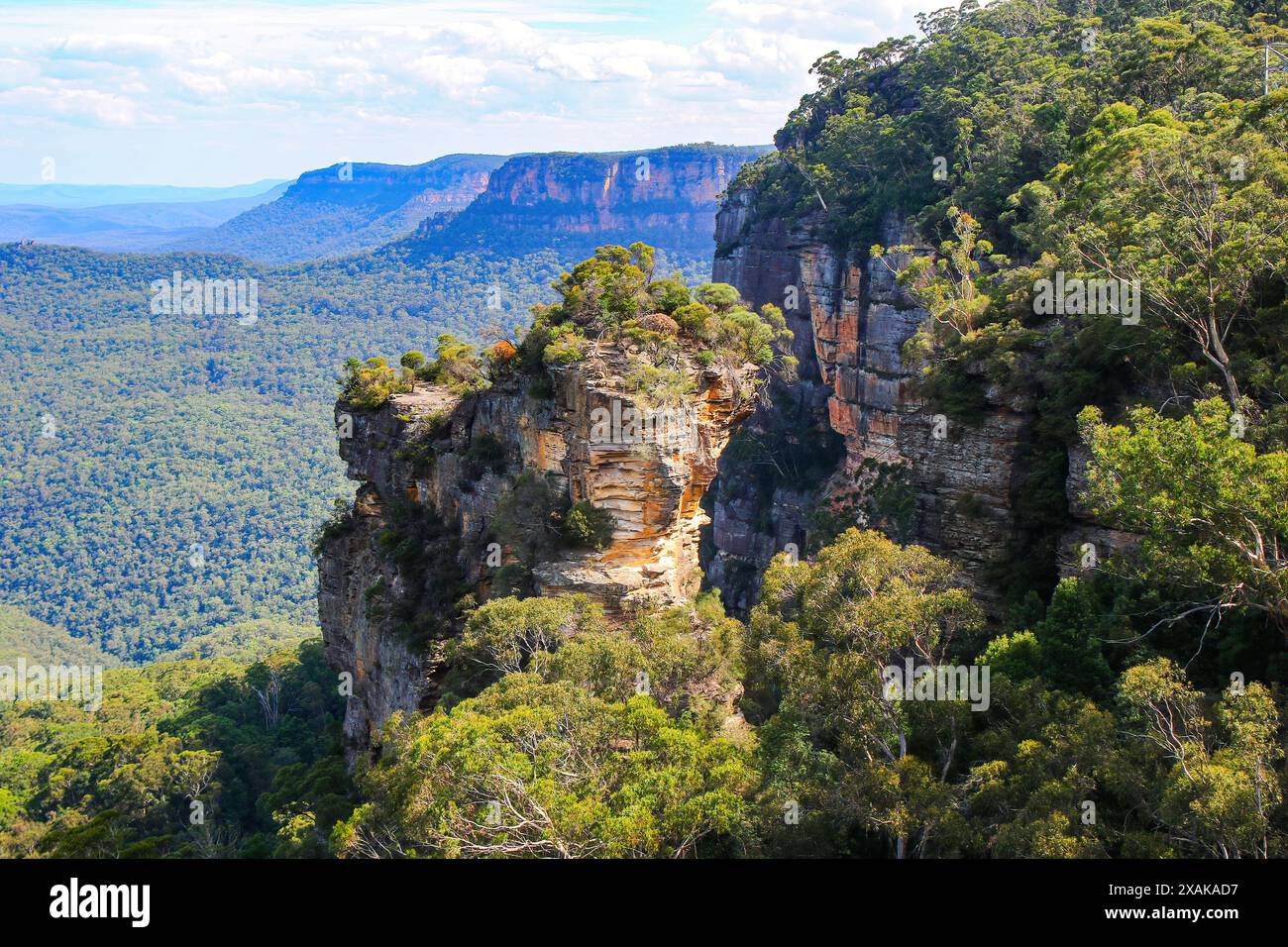 Orphan Rock, a rocky outcrop protruding over the rainforest of the ...
