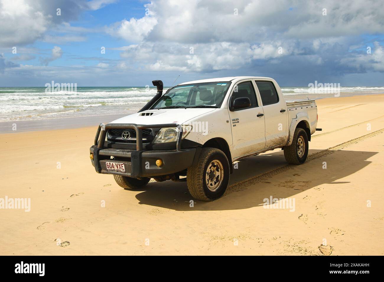4-wheel drive pickup on the sandy highway of the 75-mile beach on the ...