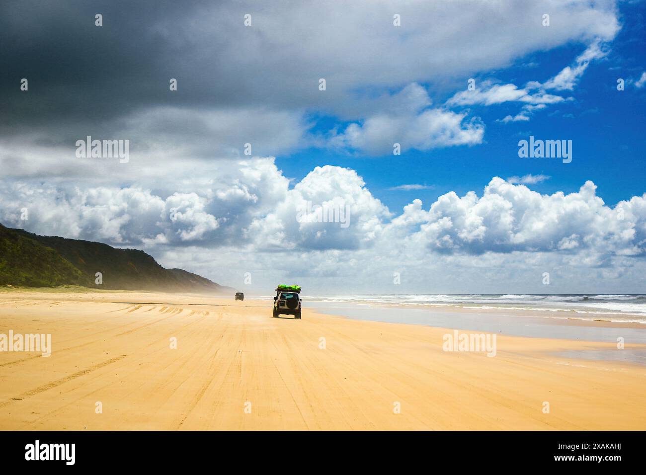 4-wheel drive pickups travelling on the sandy highway of the 75-mile ...