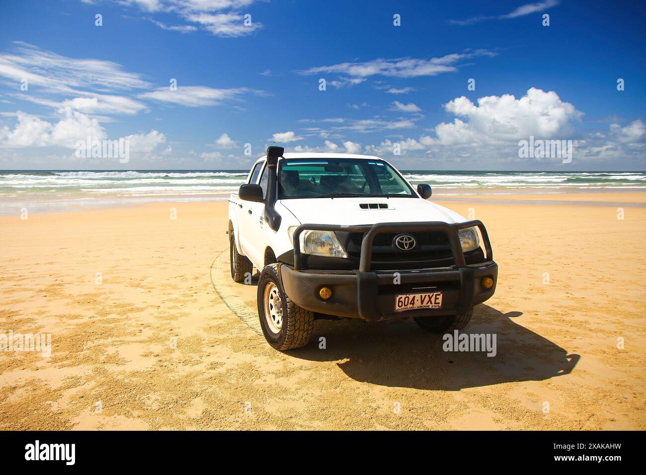 4-wheel drive pickup on the sandy highway of the 75-mile beach on the ...