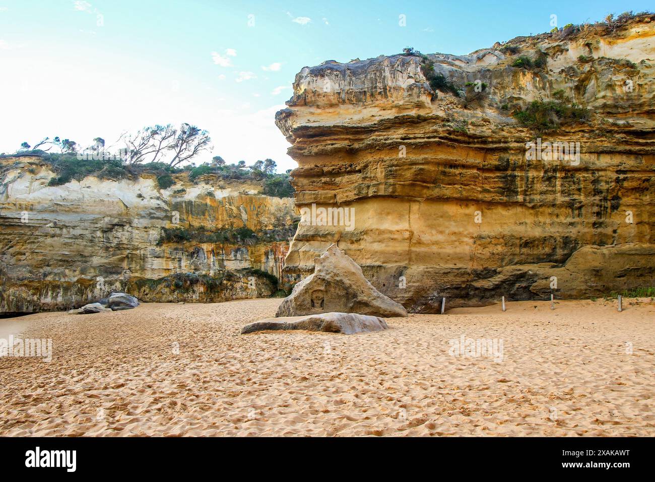 Beach in Loch Ard Gorge surrounded by sandstone cliffs at the Twelve ...
