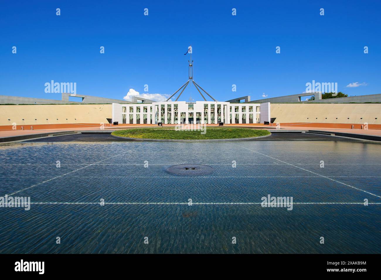 Shallow circular pond in front of the Parliament House of Australia on Capital Hill in Canberra ...