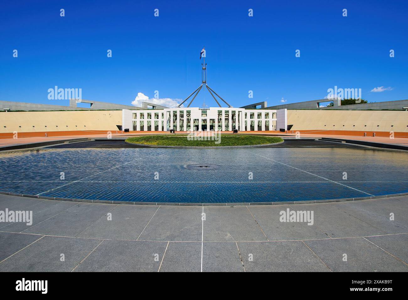 Shallow circular pond in front of the Parliament House of Australia on Capital Hill in Canberra ...