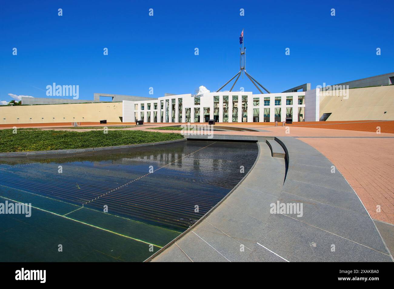 Shallow circular pond in front of the Parliament House of Australia on Capital Hill in Canberra ...