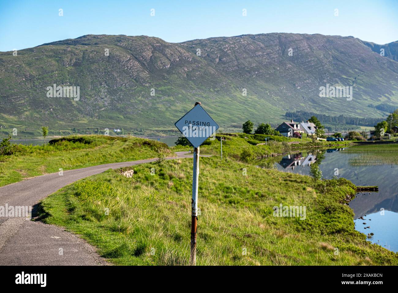 Passing place sign beside single track road in village of Applecross on ...