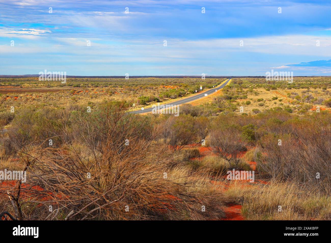 Long A4 road heading west in the the bushy terrain of the Red Center of ...