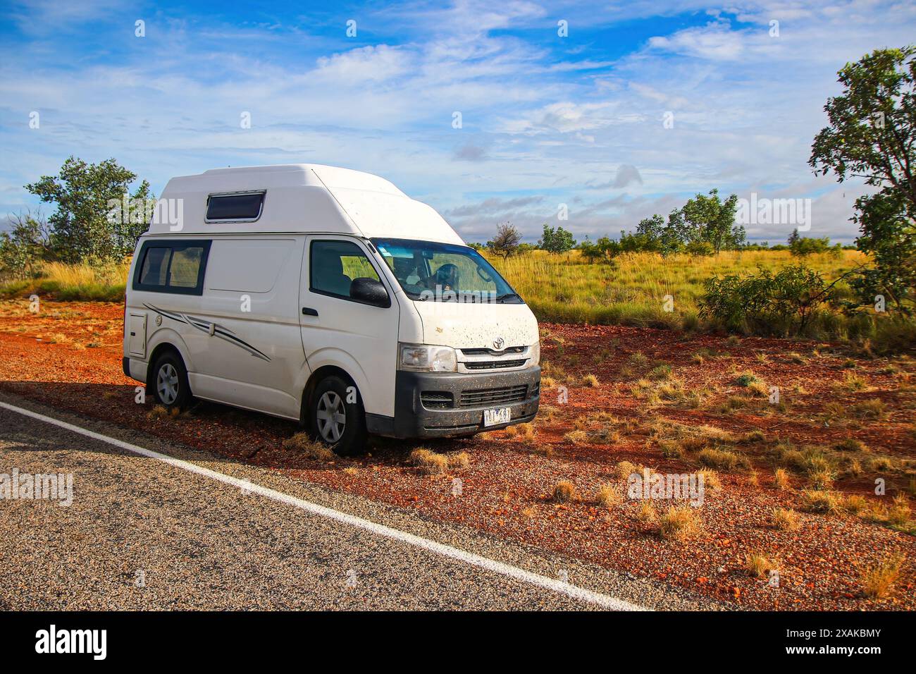 Toyota HiAce campervan parked on the roadside of Barkly Highway in the ...