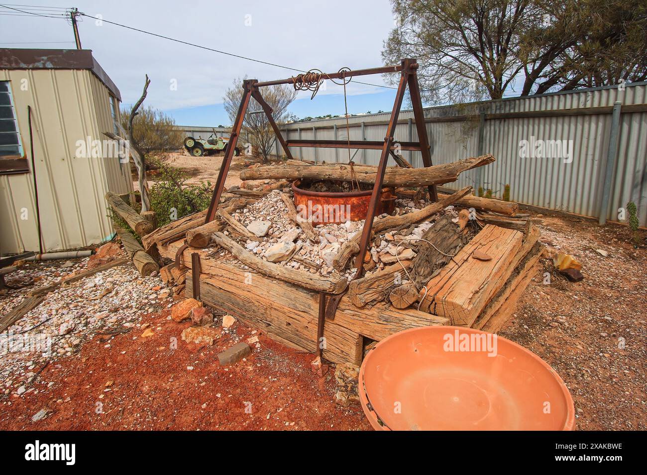 Campfire outside Faye's Underground House, a popular tourist attraction ...