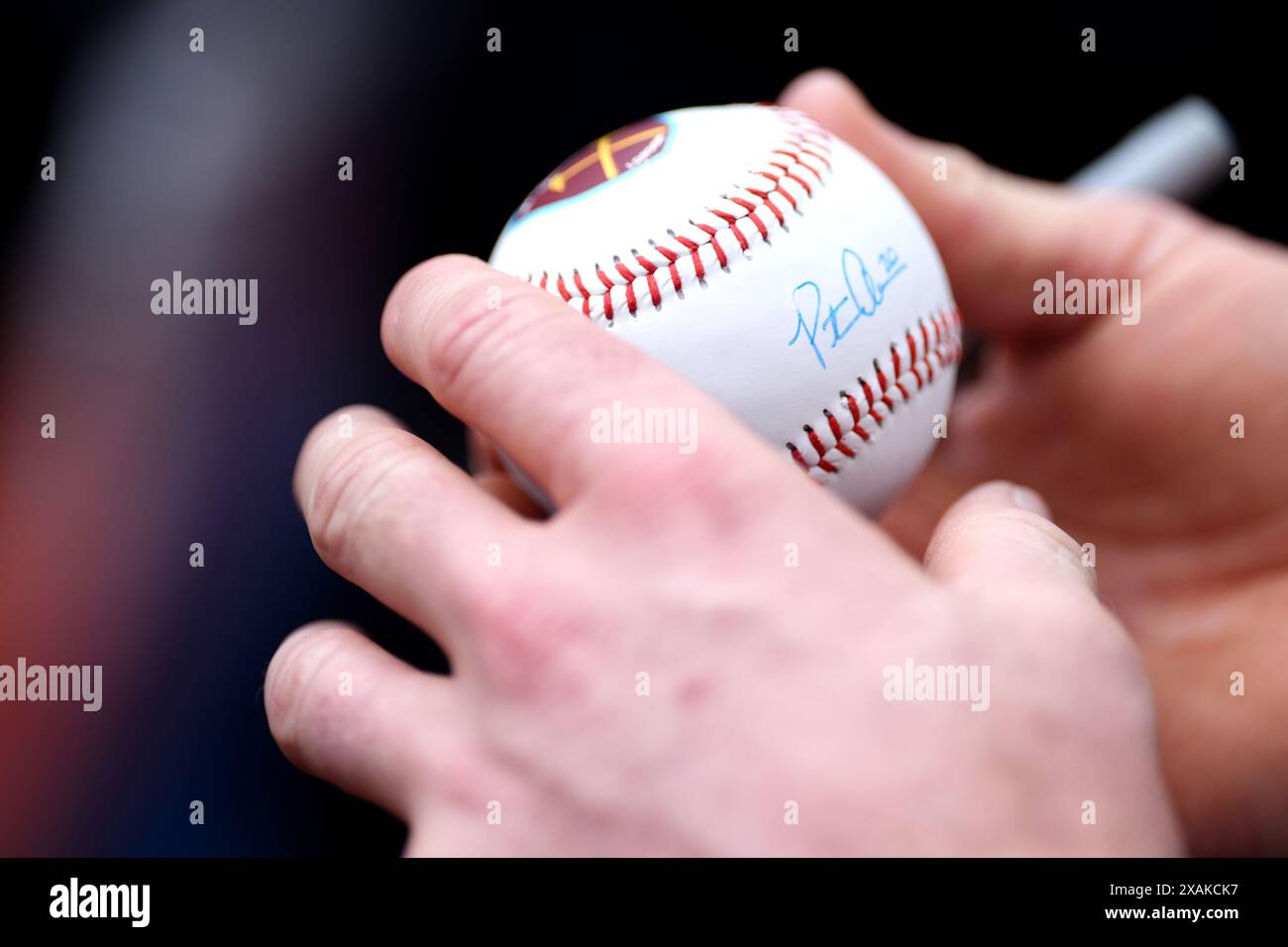 New York Mets' Pete Alonso signs a baseball during a workout day ahead ...