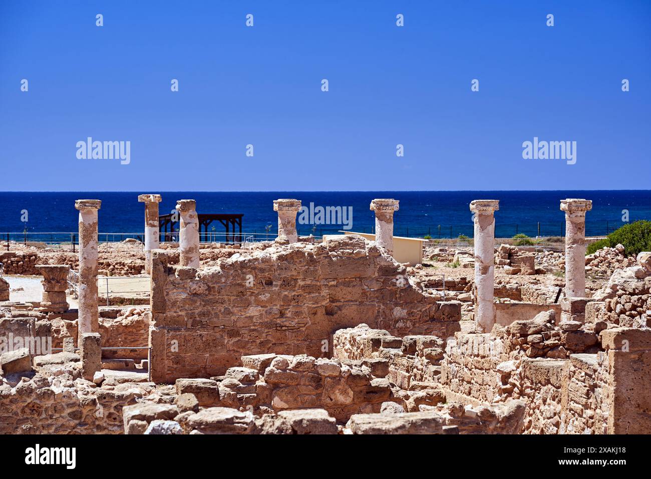 stone columns standing among the ruins of ancient buildings in the ...