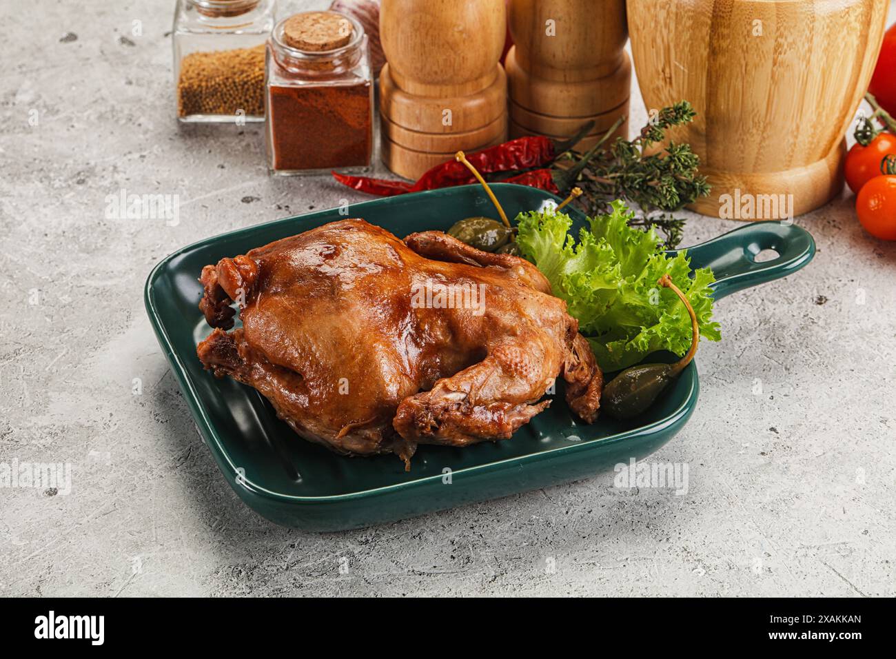 Baked whole small chicken with spices Stock Photo - Alamy